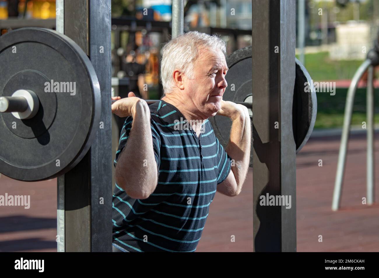 Person exercising lifting weights in hi-res stock photography and ...