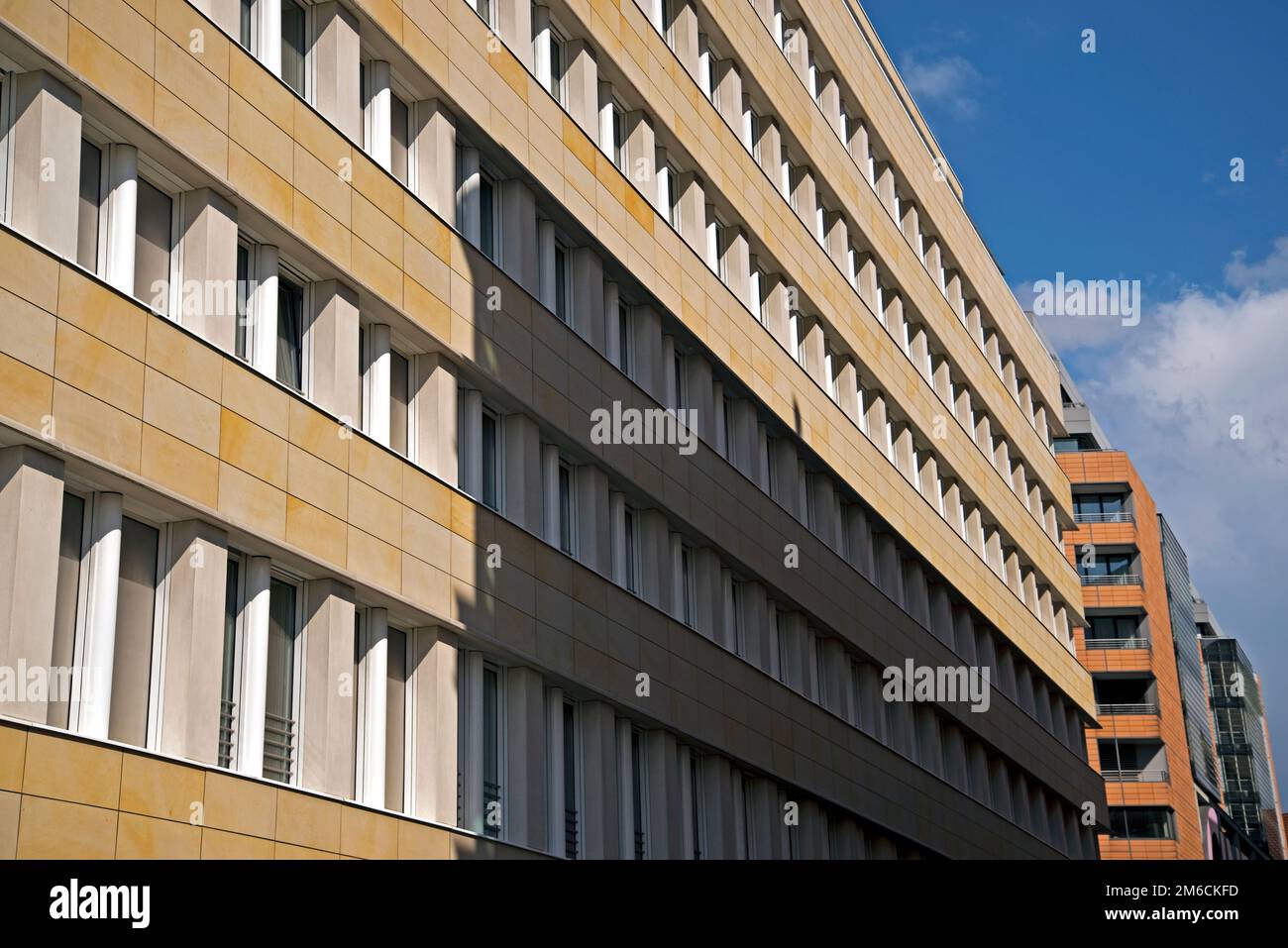 Multi-storey house facade in light and shadow Stock Photo - Alamy