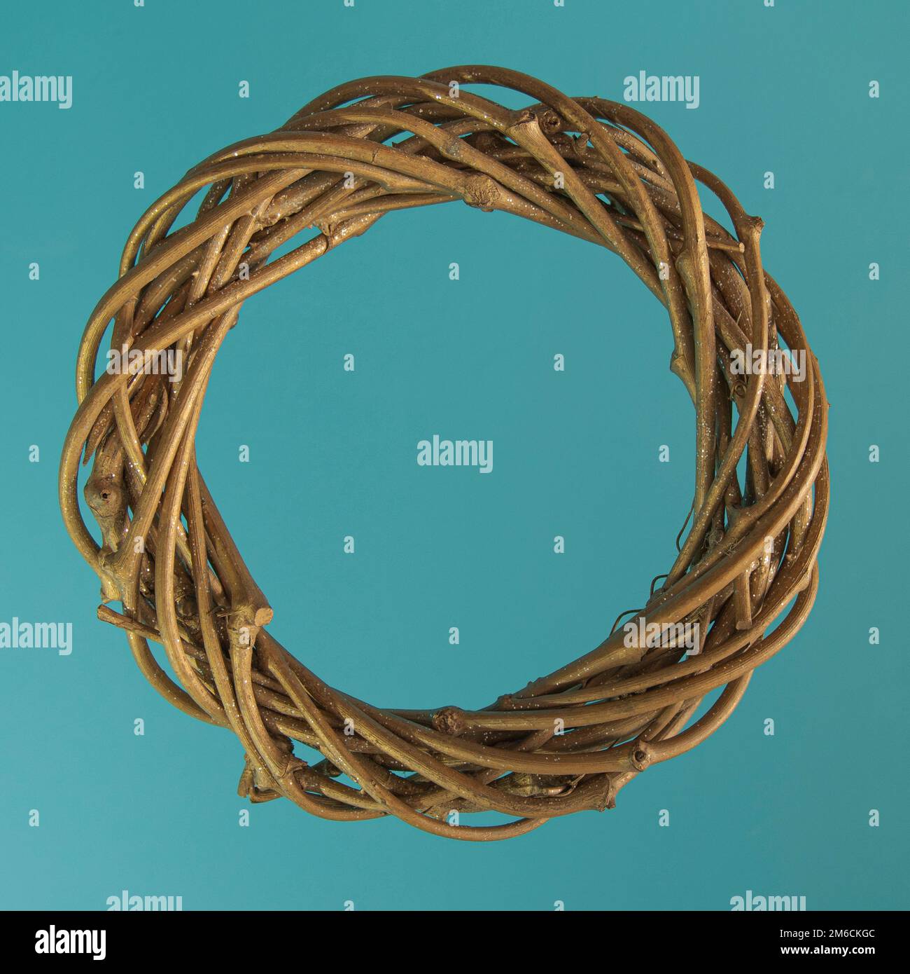 Christmas wreath made of twigs with gilding. Square format. Close-up ...