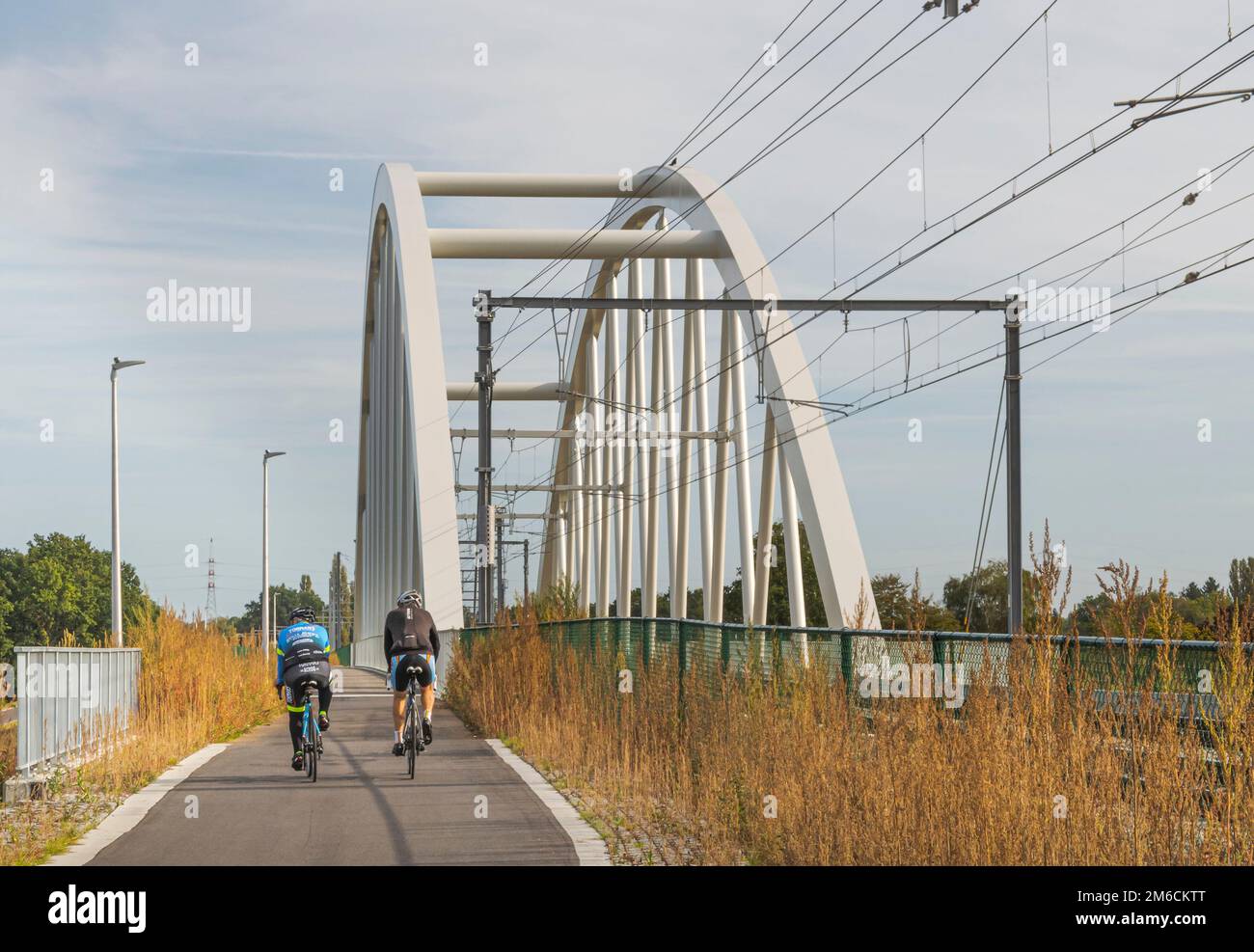 Hasselt. Limburg - Belgium 27-09-2021. Walking bicycles in autumn. Two men on bicycles in the ...