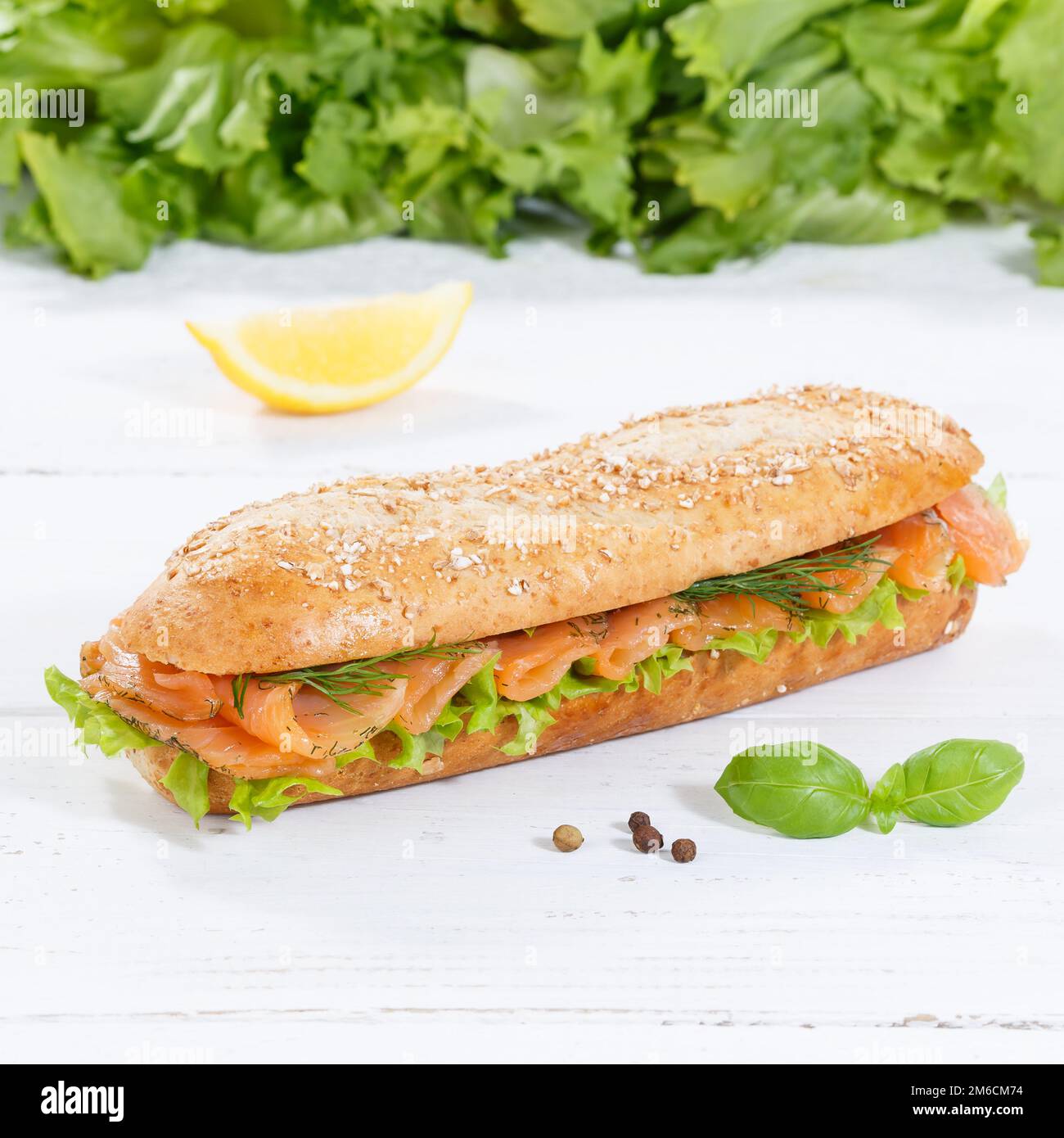 Roll sandwich wholemeal baguette topped with salmon fish square on ...