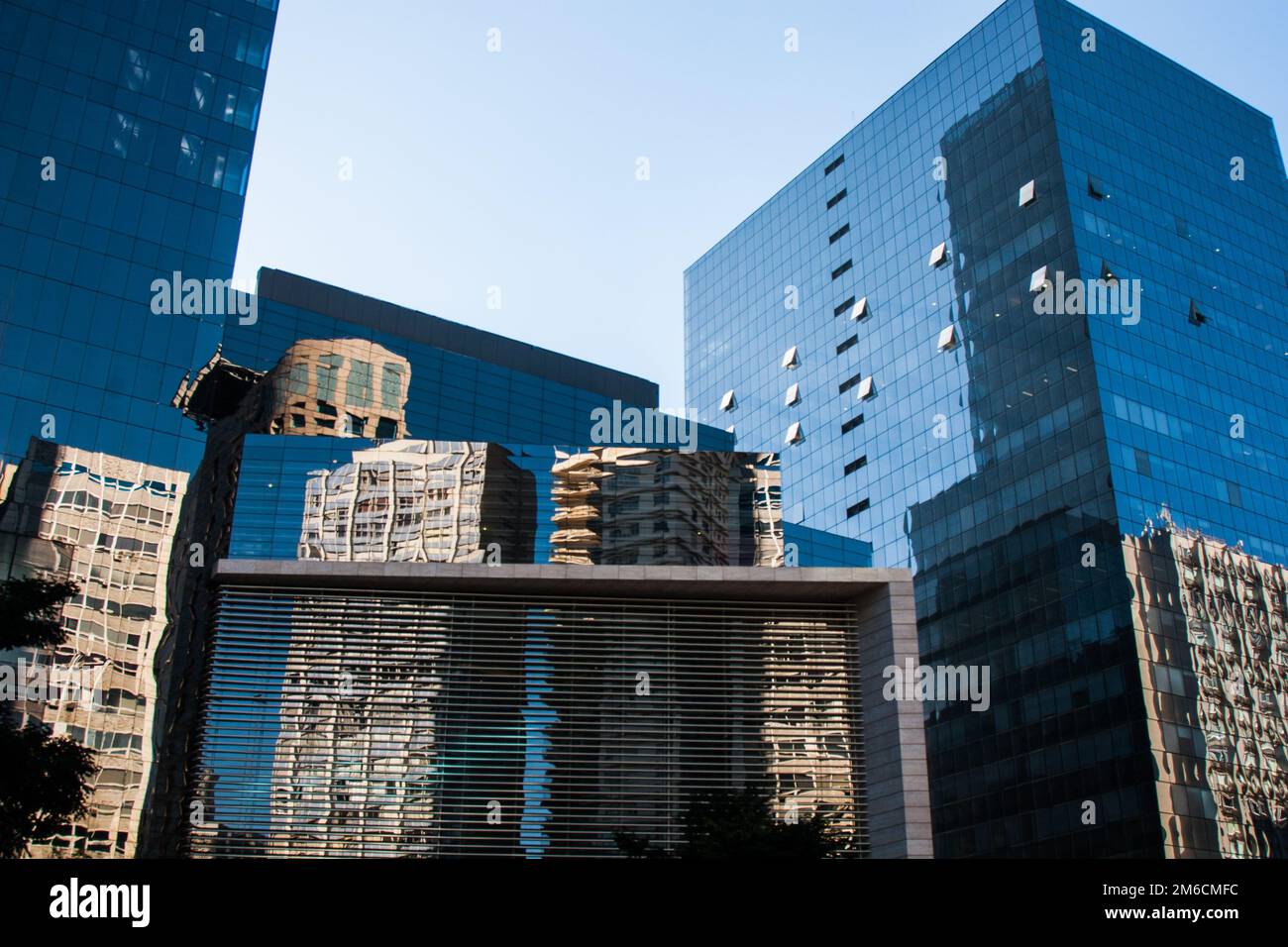White buildings reflection on blue glass corporate buildings windows ...