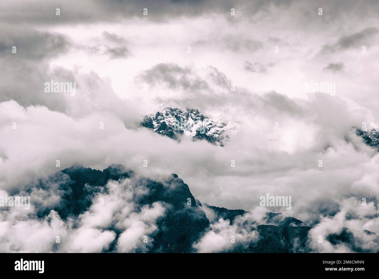 Intense fog and clouds covering the peak of a mountain on the Andes ...