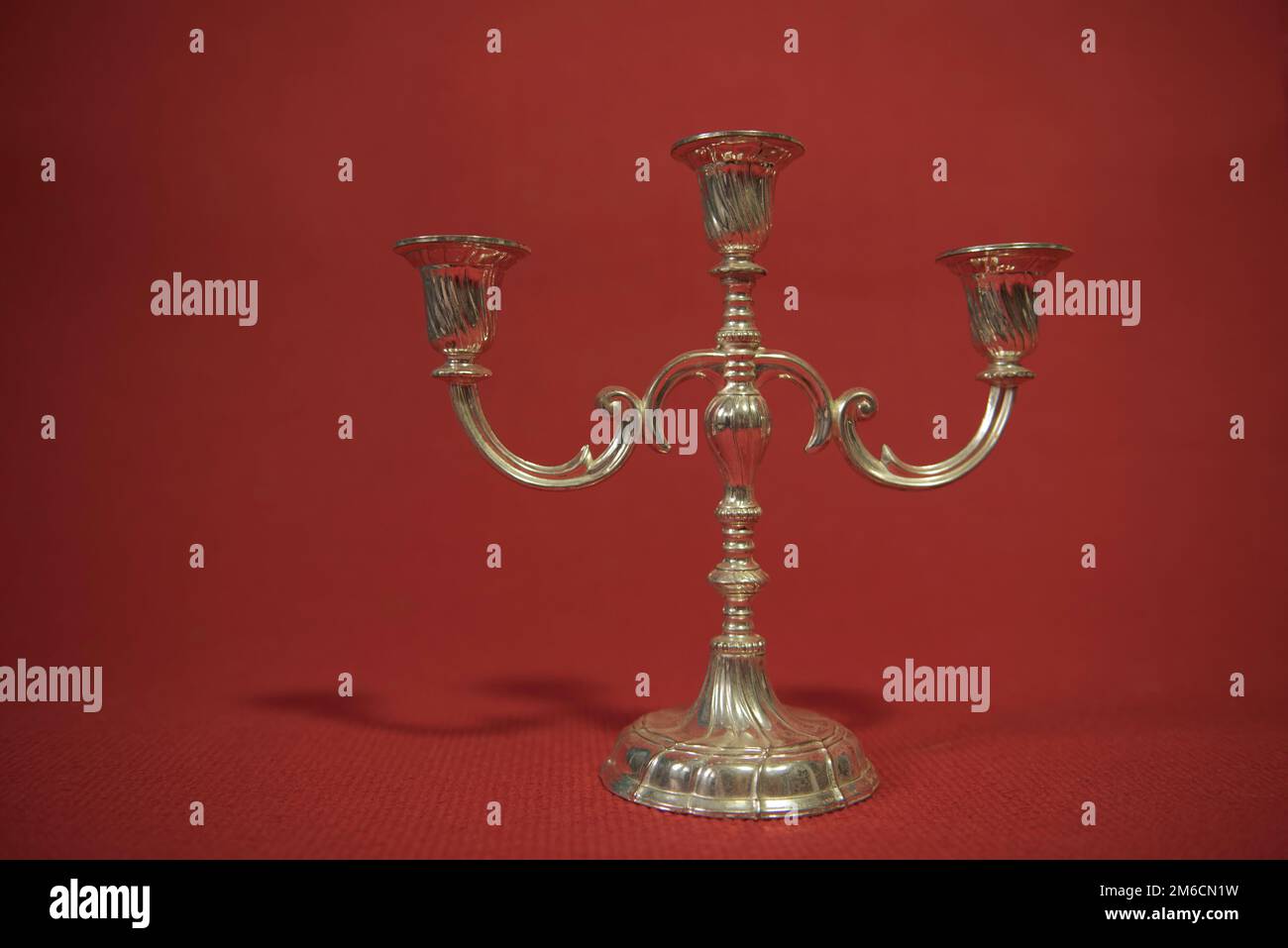 Decorative old candlestick with traces of time, before renovation. On a ...