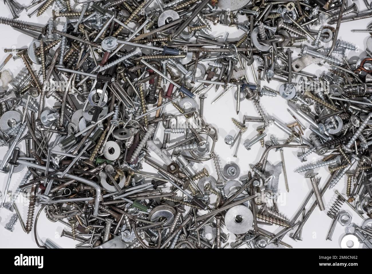 A lot of cogs, screws, bolts and moods on a white background Stock ...