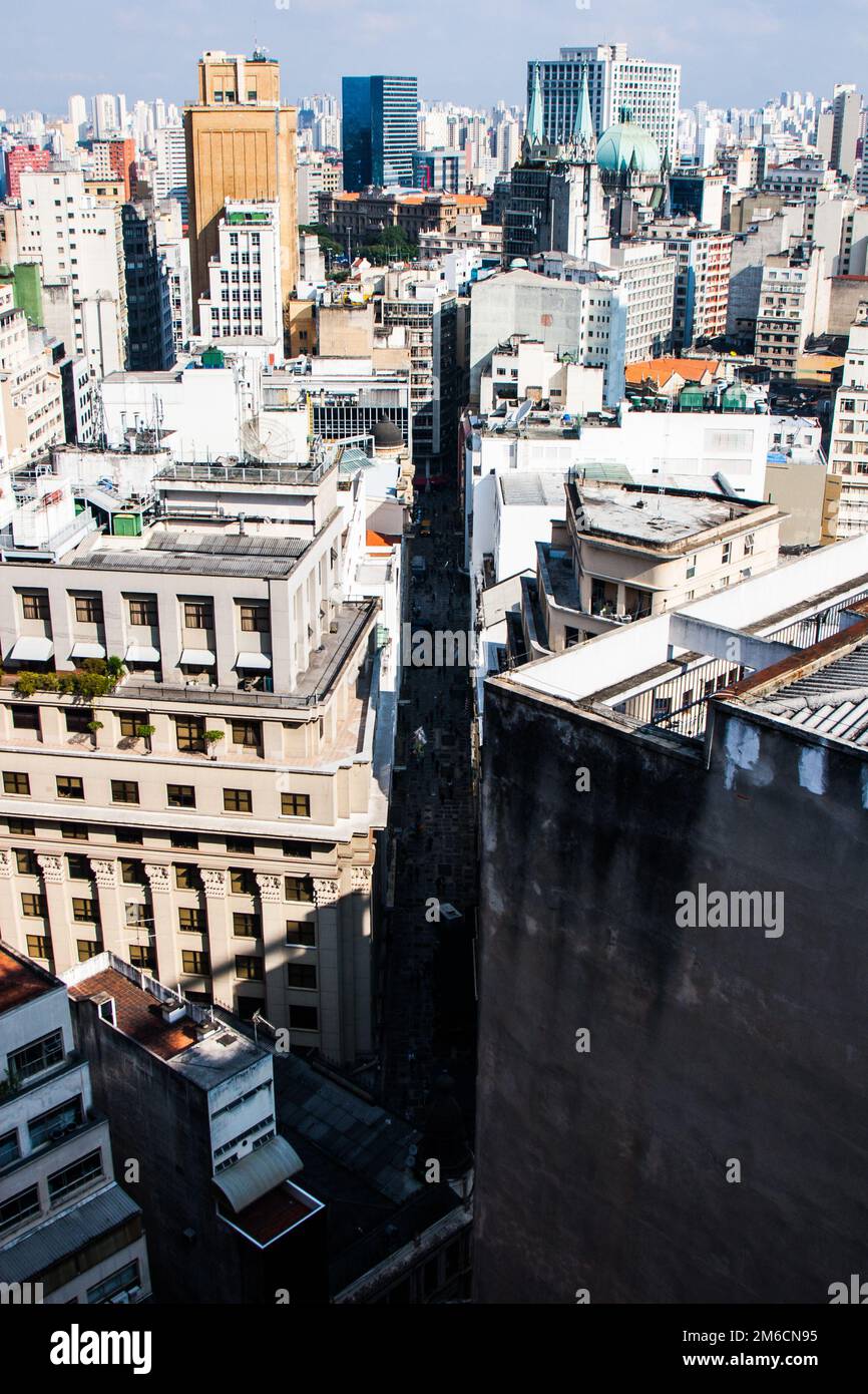 View from the top of a building of a street cutting the city in half ...