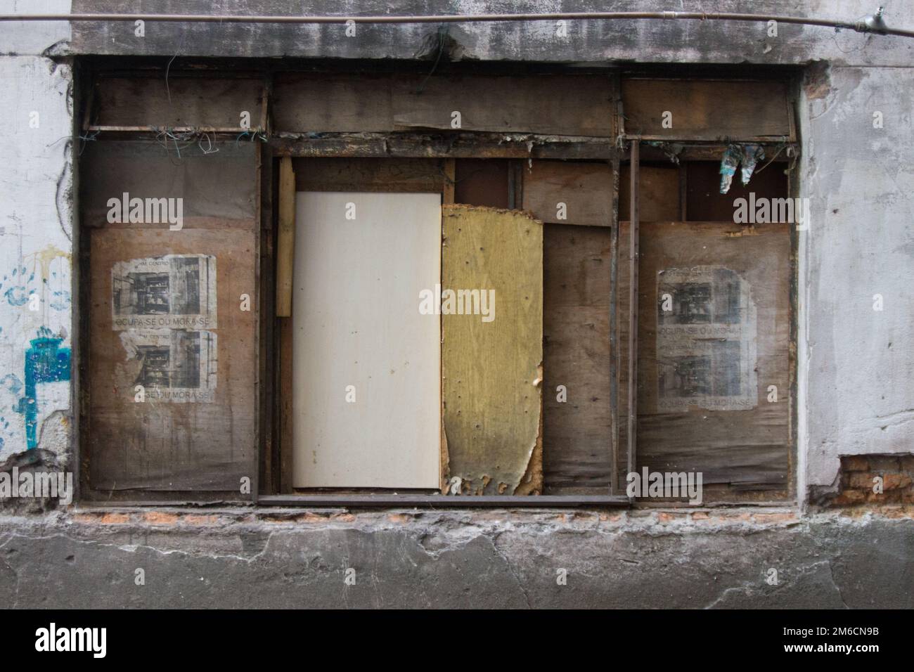 Ruined walls and window in an abandoned accupied building Stock Photo ...