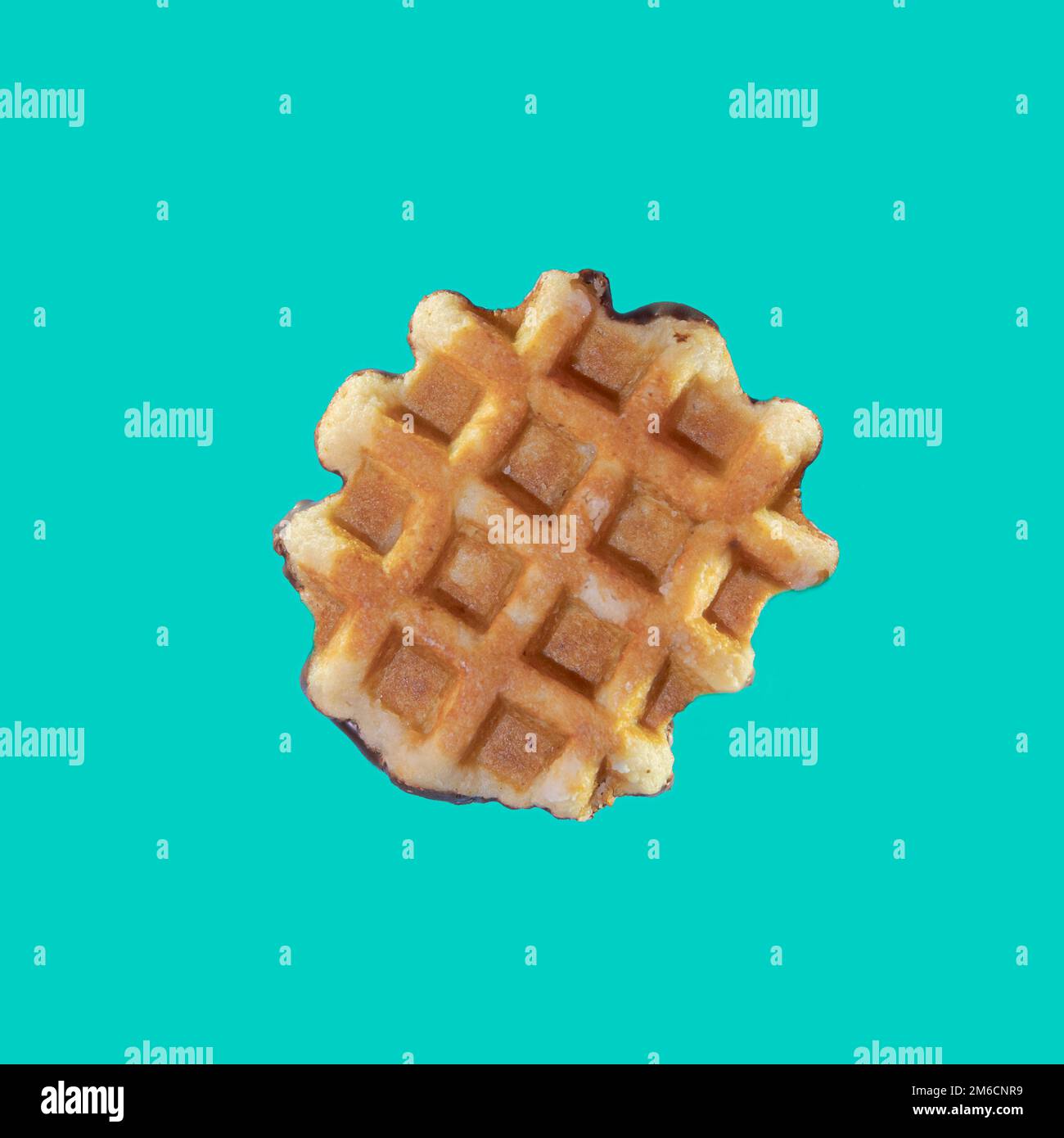 The texture of a standard waffle, on a light blue background. Square ...
