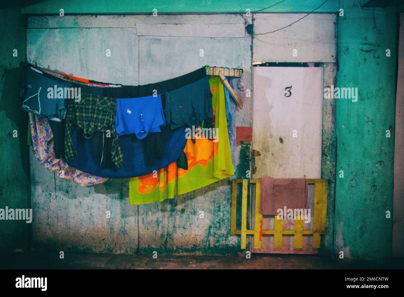 Clothes hanged to dry outside of a home in a dilapidated occupied ...