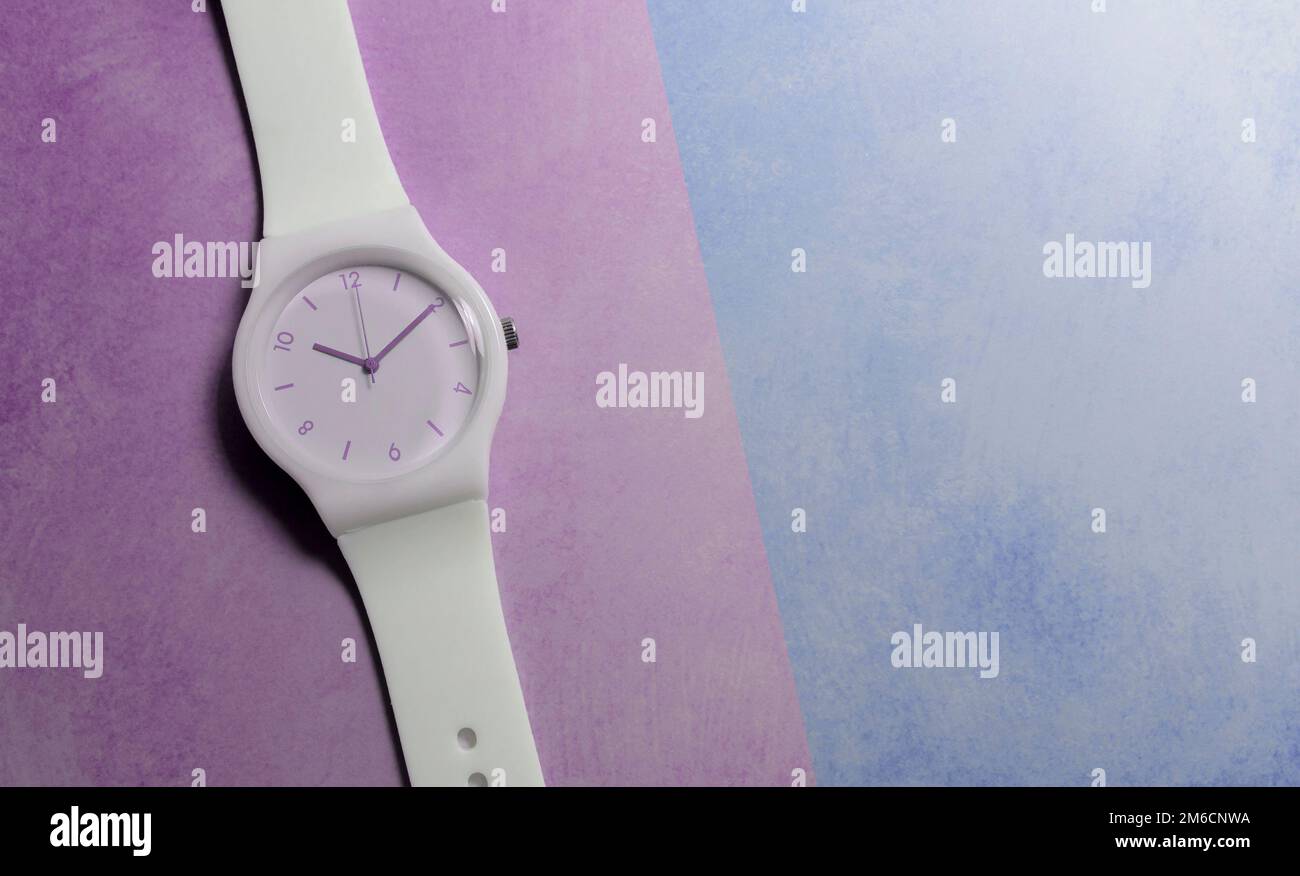 Watches white dial female. Blue-pink background Stock Photo - Alamy