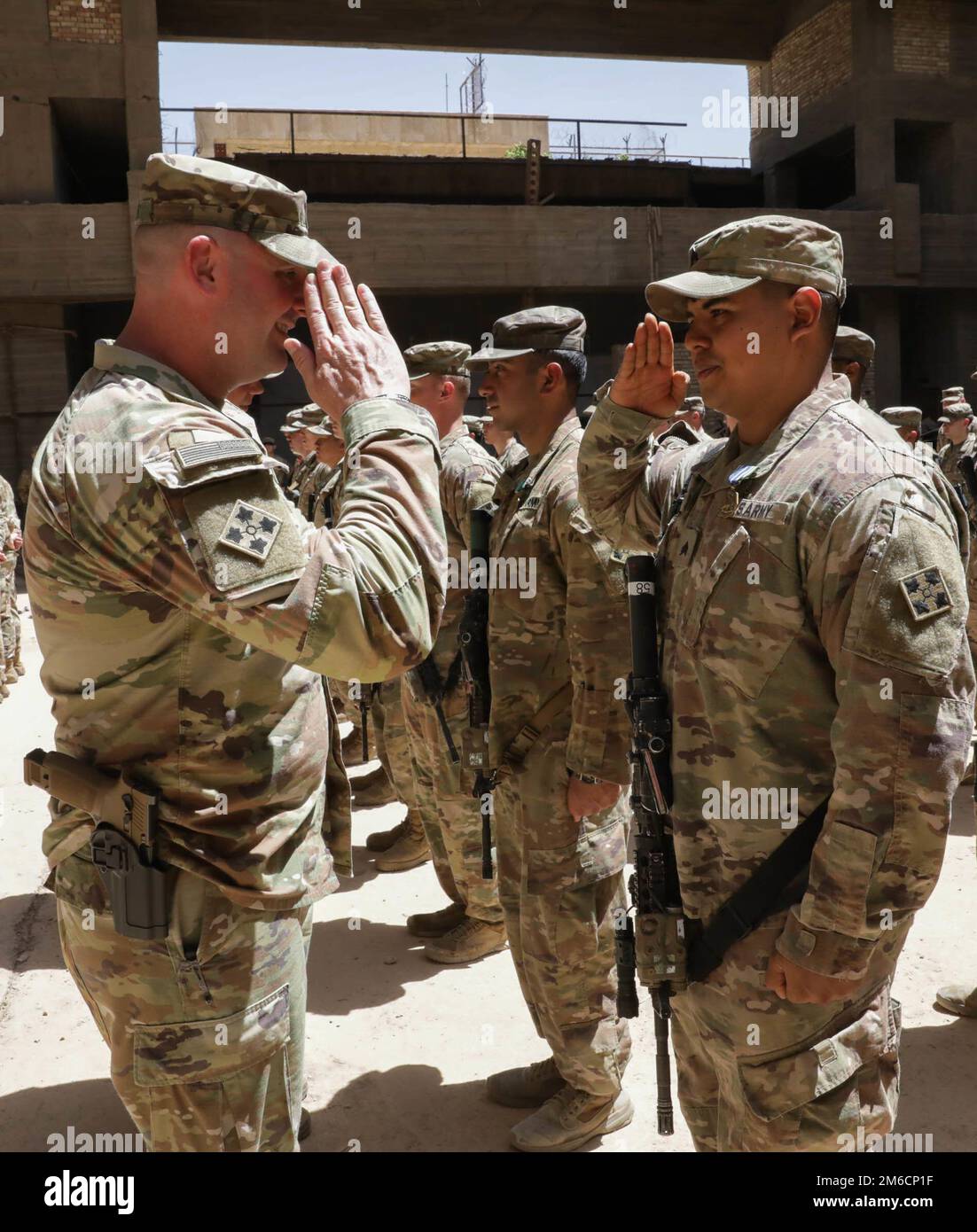 Lt. Col. Gregory Polk, the Task Force Pioneer commander, salutes a U.S ...