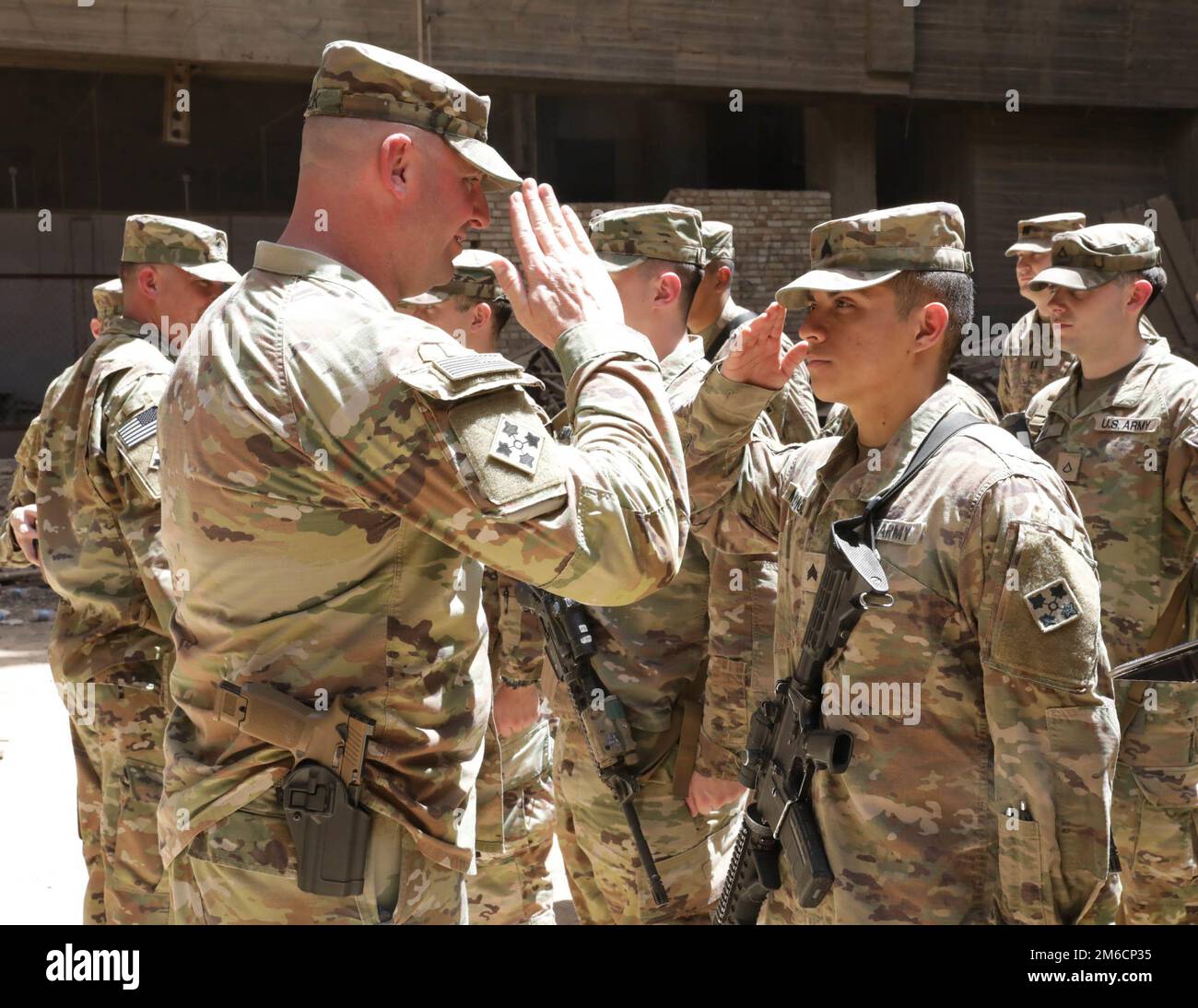 Lt. Col. Gregory Polk, the Task Force Pioneer commander, salutes a U.S ...