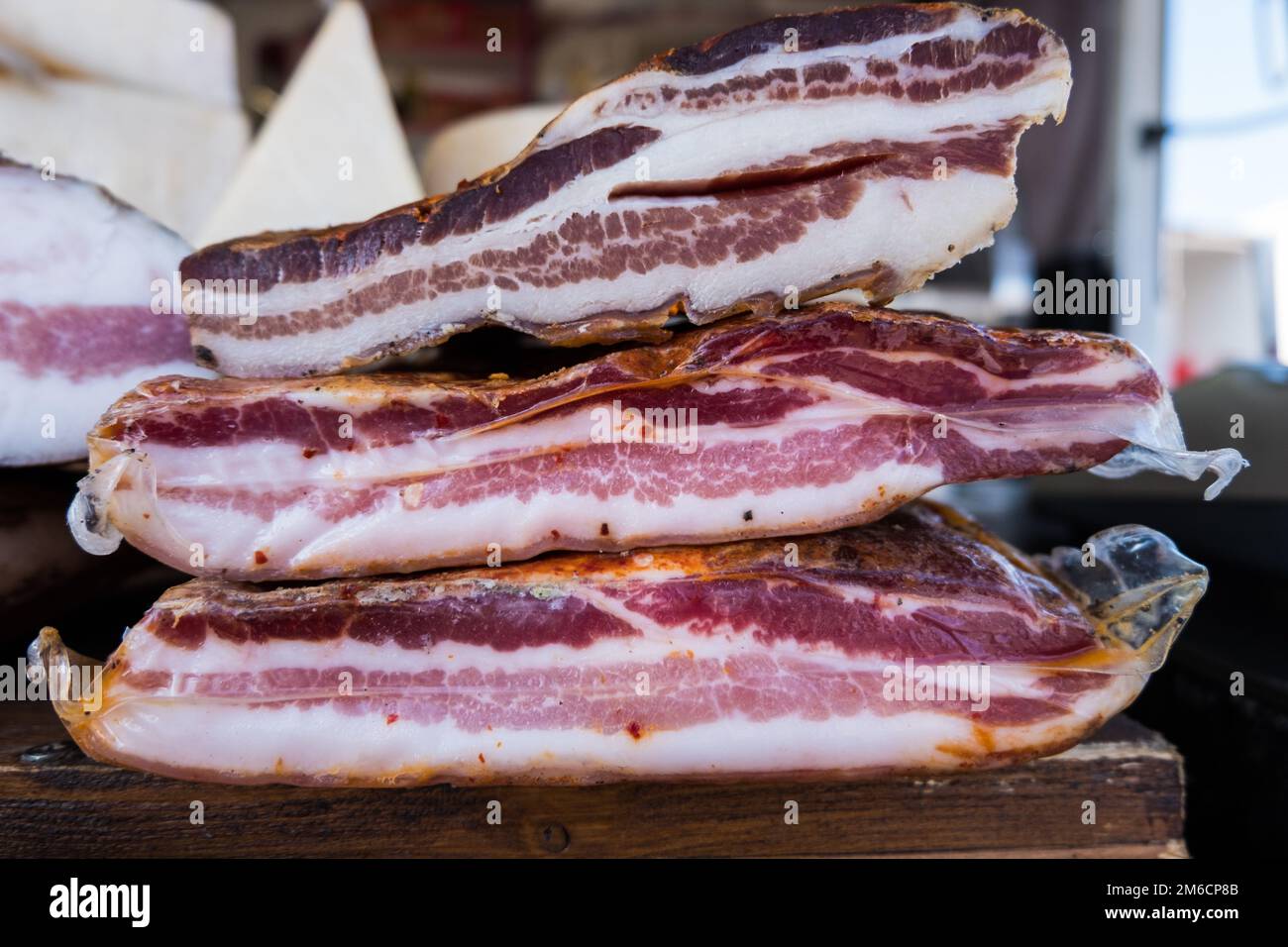 Fresh bacon stand at a street organic food market Stock Photo - Alamy