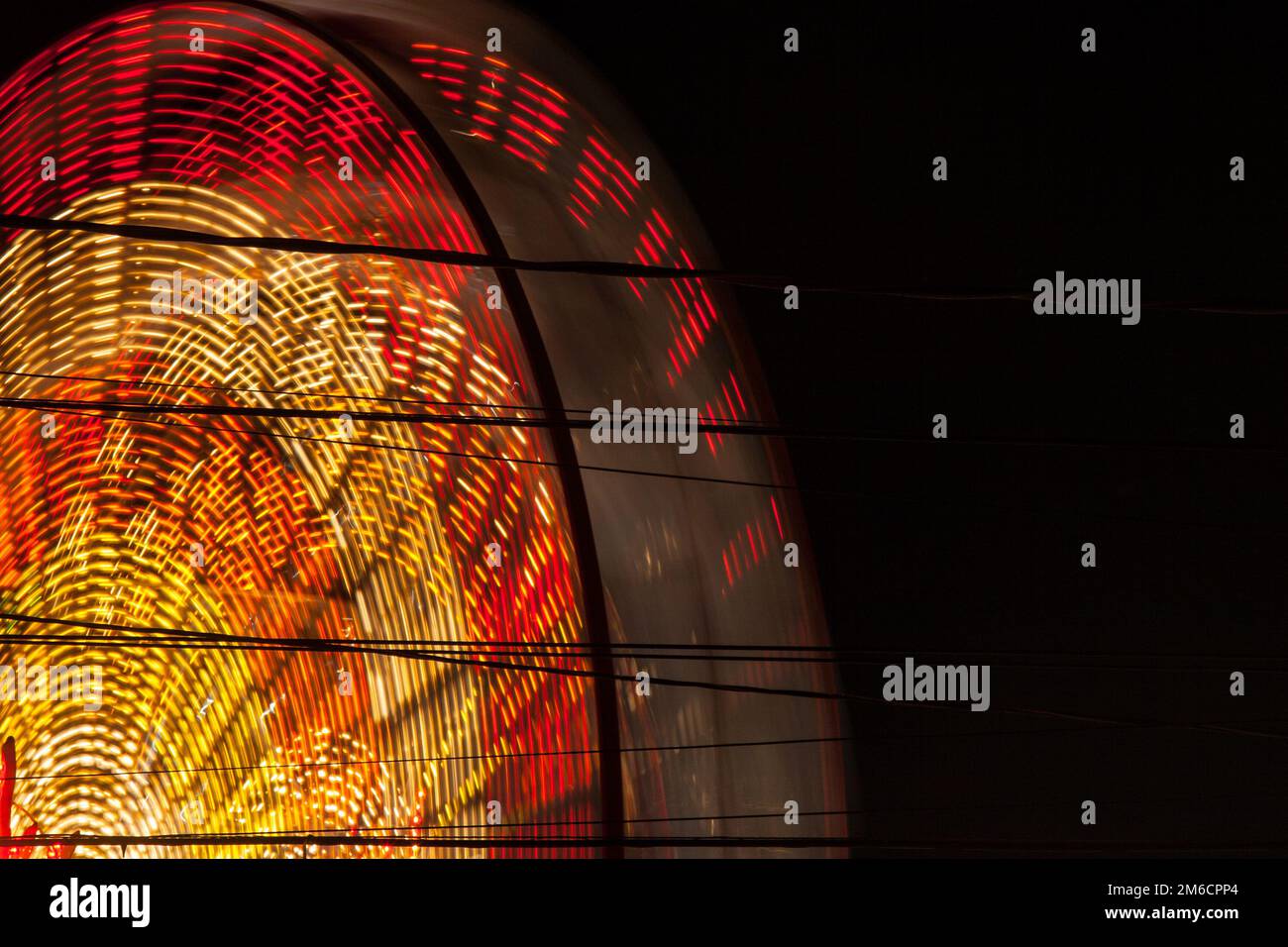 Giant wheel spinning at night Stock Photo - Alamy