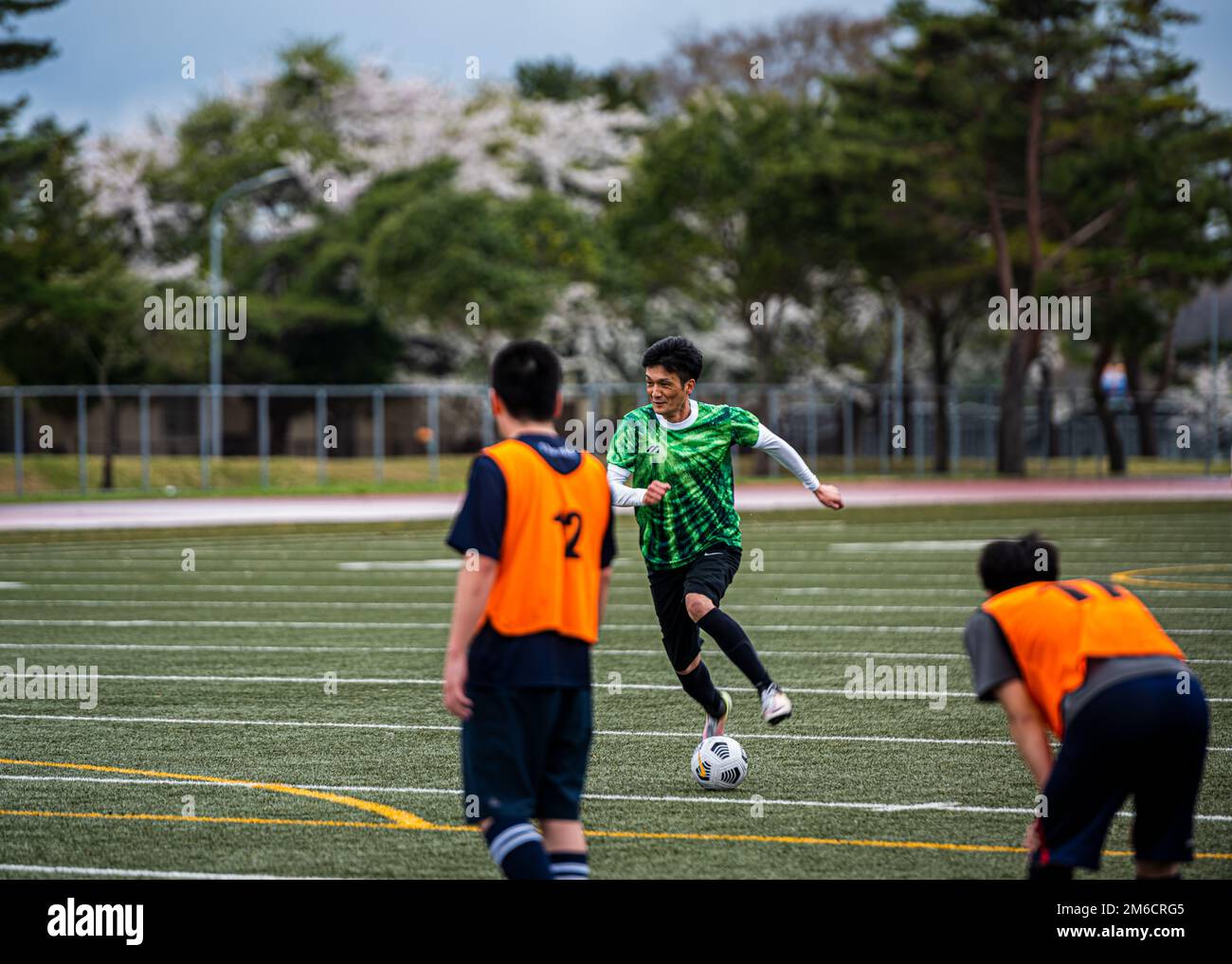 Participants from Team Misawa play soccer during the first-ever Sakura ...