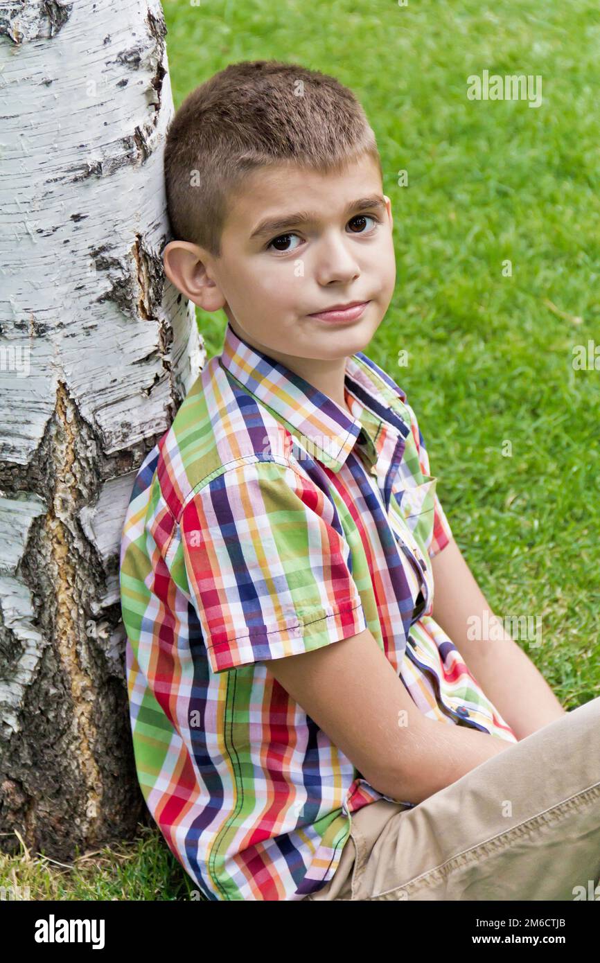 Cute brunette boy eleven years old Stock Photo - Alamy