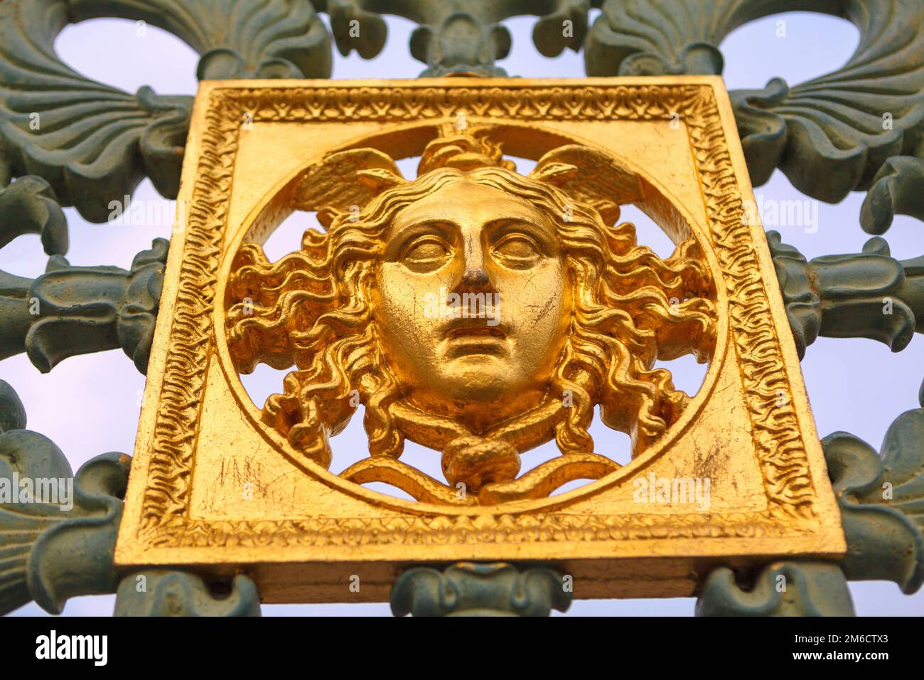 Golden figure of the sun . Carved sun in gold . Sun with face Stock ...