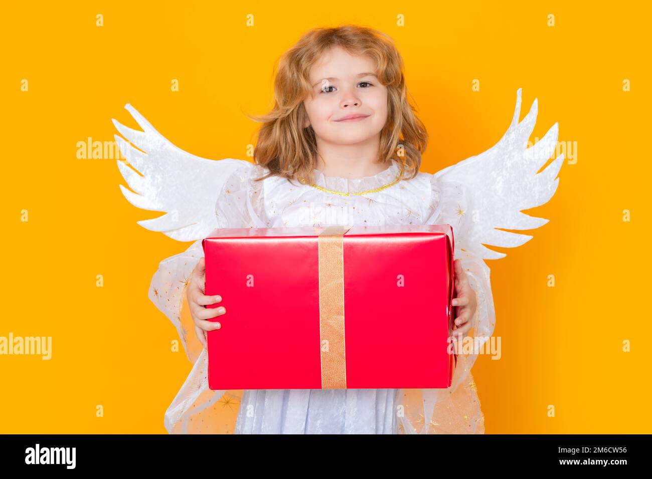 Cute blonde kid angel with gift box present. Valentines day. Little ...