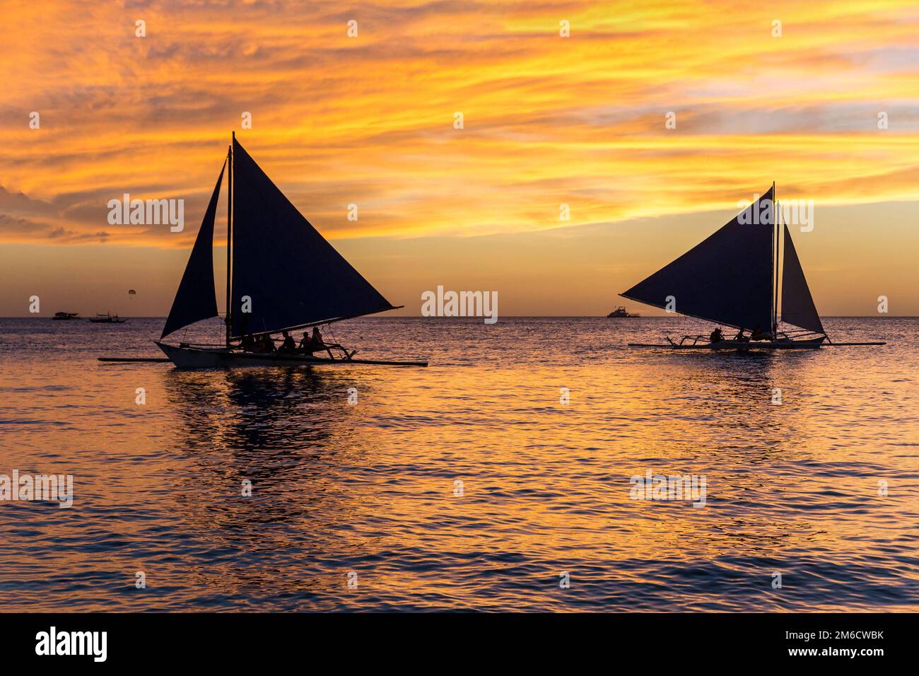 Small sailing boats at the sunset. Boracay, Philippines Stock Photo - Alamy