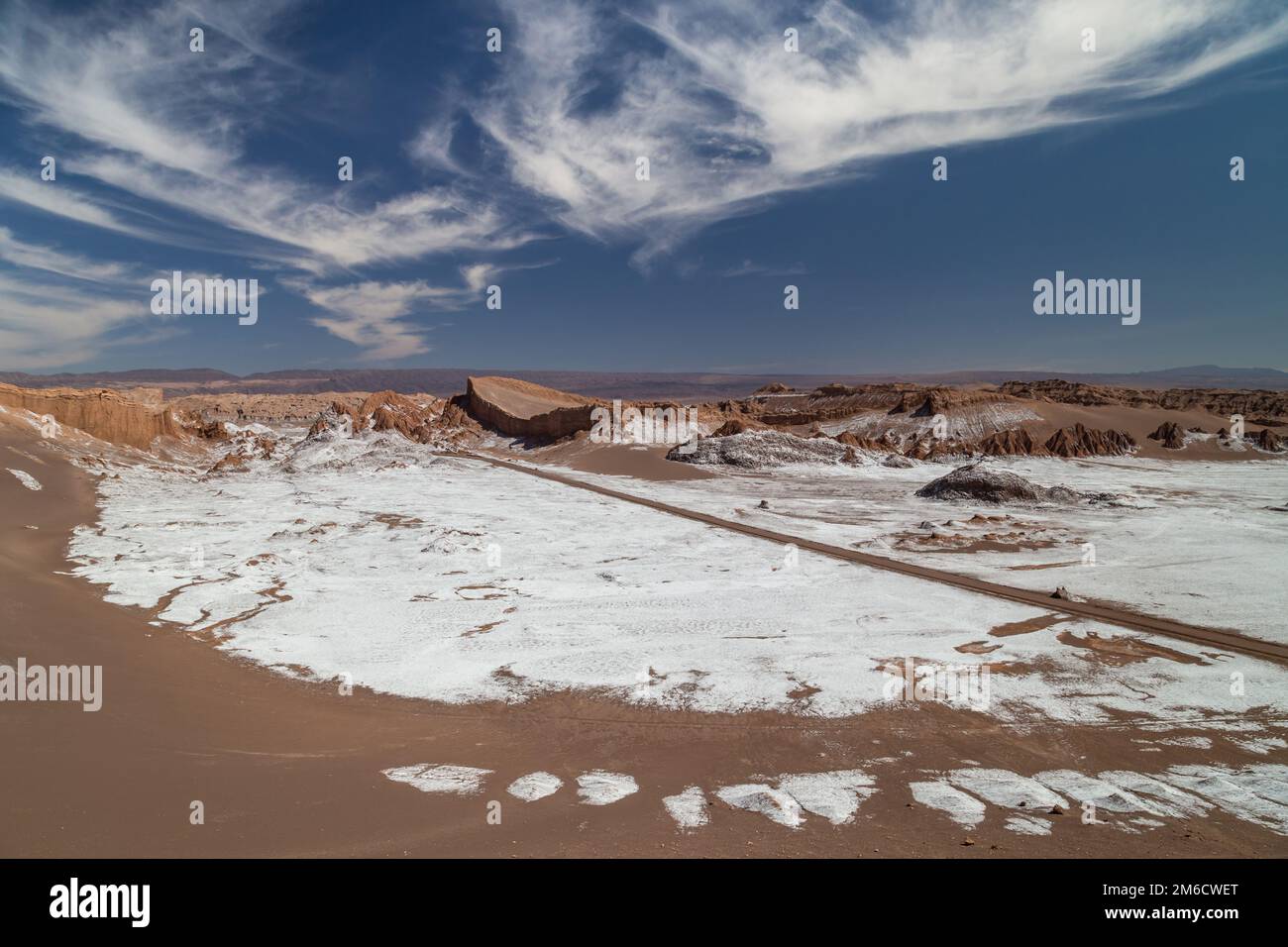 Dunes and rock formations covered with dry salt in Valle de la Luna ...