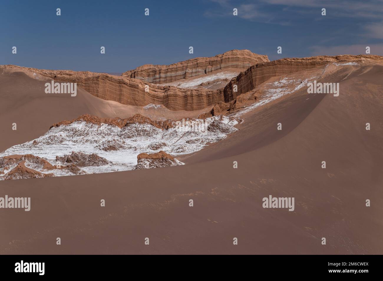 Dunes and rock formations covered with dry salt in Valle de la Luna ...