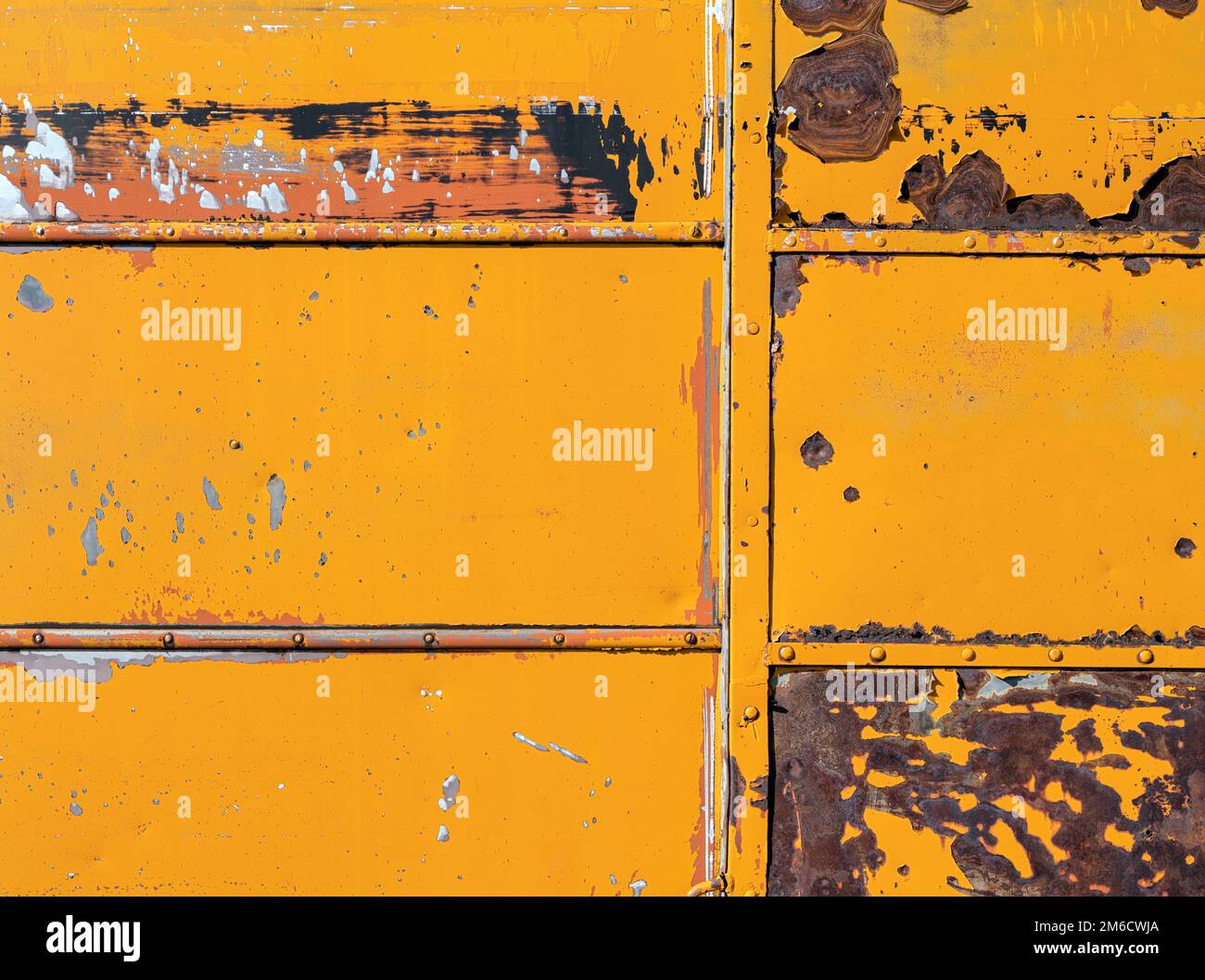 Section of a rusty metal shipping container used for storage at a ...
