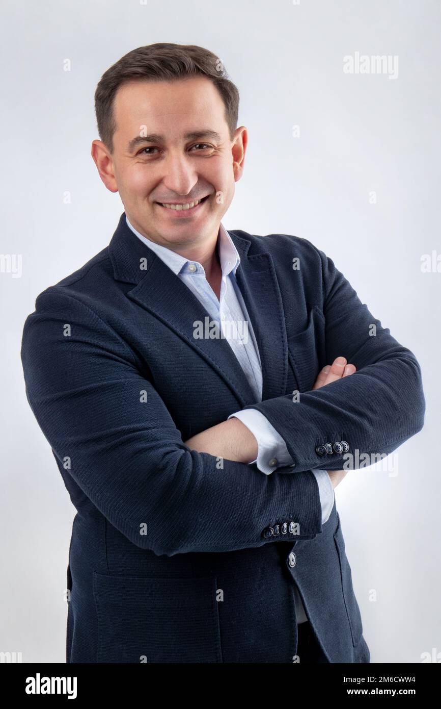 Portrait of a handsome business man smiling Stock Photo - Alamy