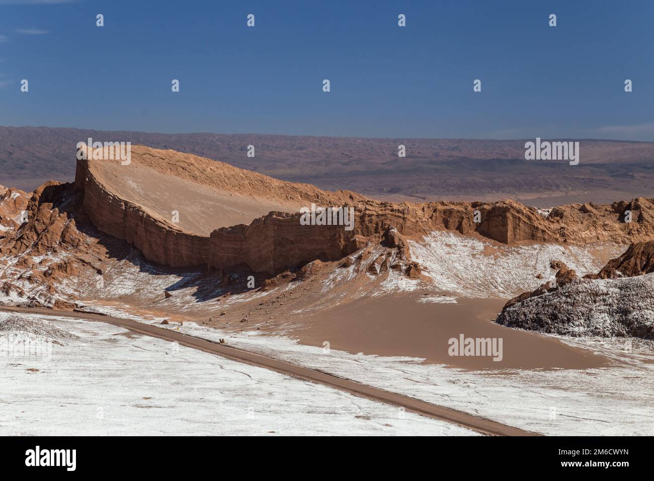 Dunes and rock formations covered with dry salt in Valle de la Luna ...