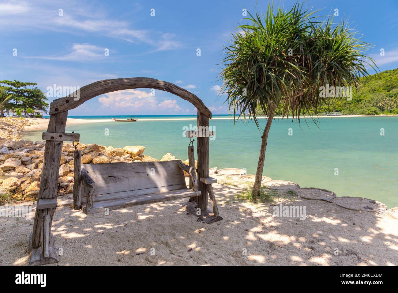Wooden swinging bench on a beach Stock Photo - Alamy