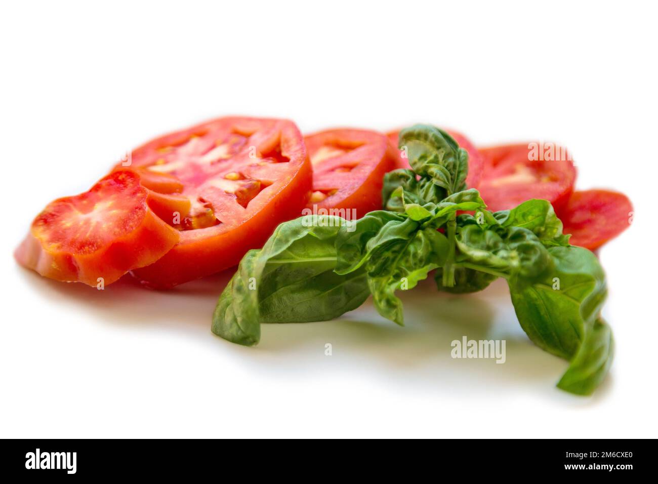 Tomato with leaves Cut Out Stock Images & Pictures - Alamy