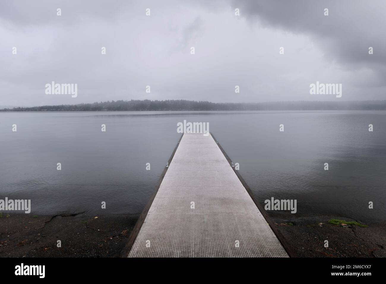 Dock jutting out on lake Stock Photo - Alamy