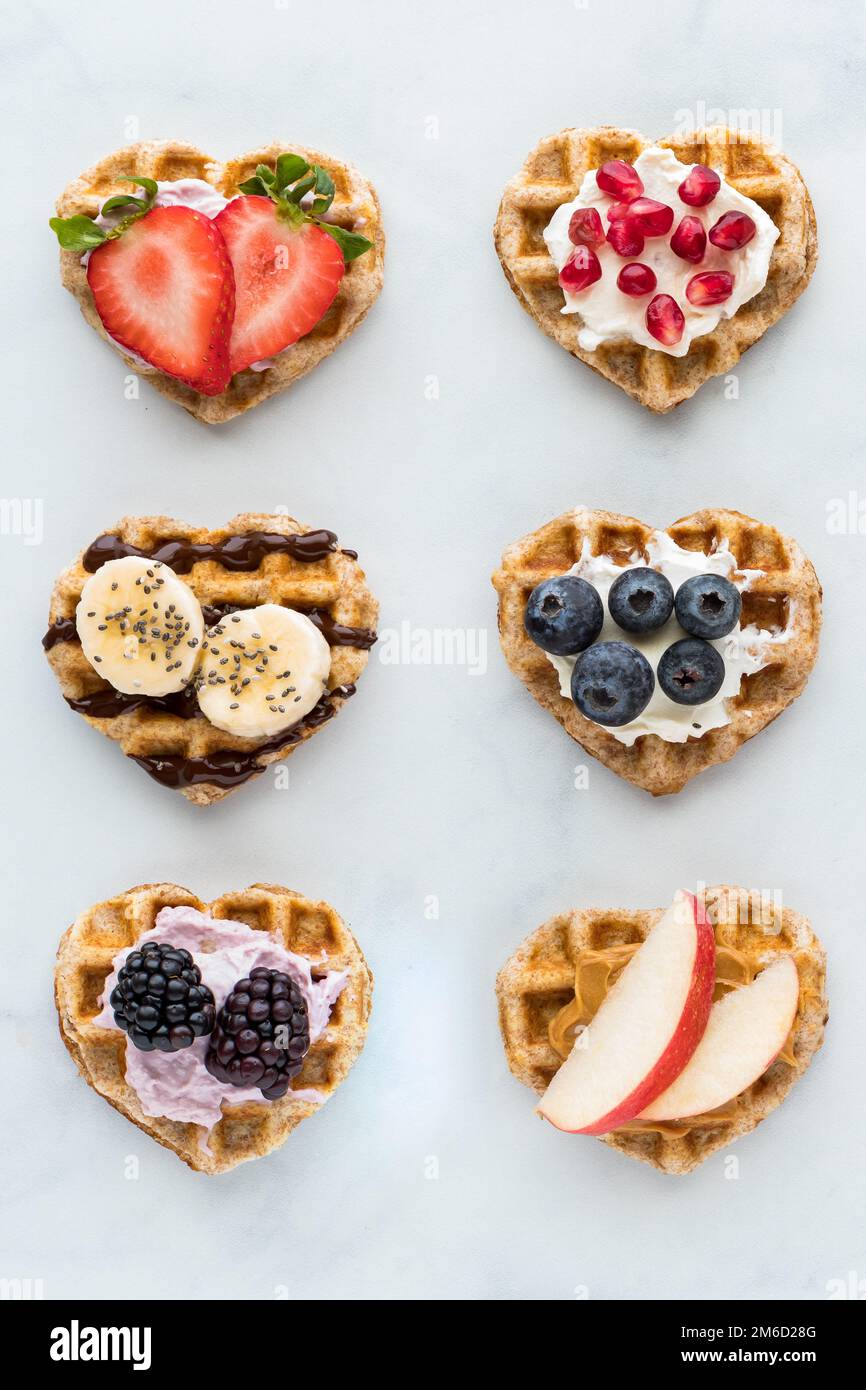 Mini heart shaped waffles topped with various spreads and fruit Stock ...