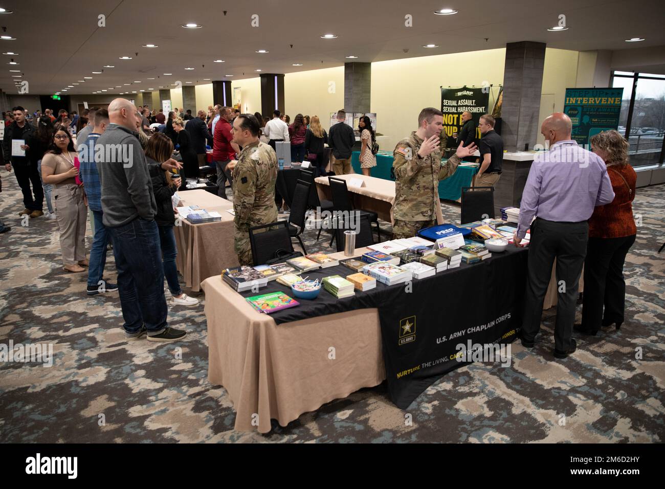 Soldiers and Family members meet with community partners while ...