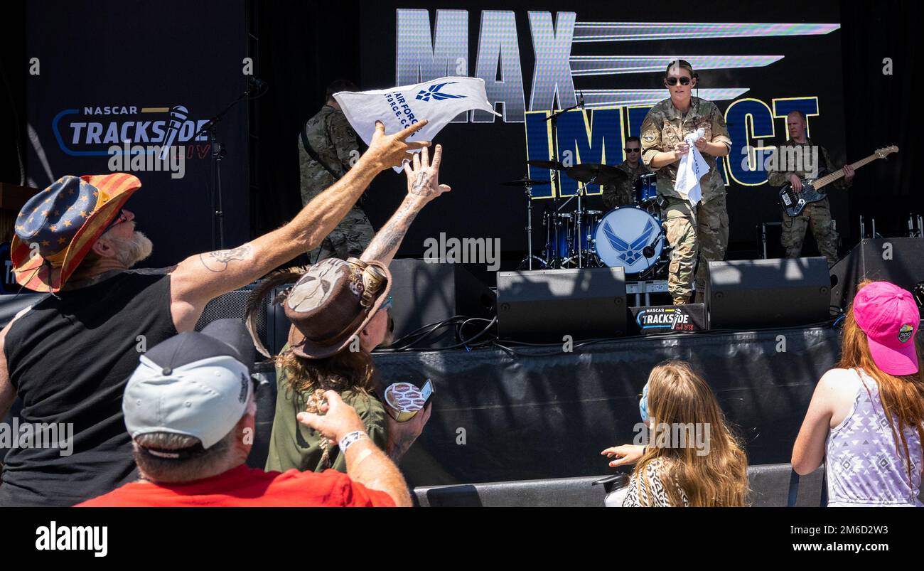 Fans grab swag from the Air Force rock band, Max Impact, during their ...