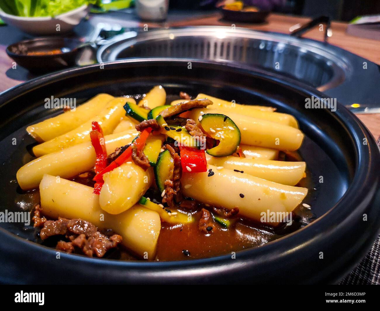 Korean Tteokbokki rice dumplings black dish in an korean ethnic ...