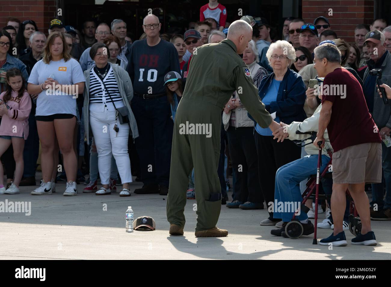 Col. Darren Hamilton, 179th Airlift Wing Commander, presents his coin ...