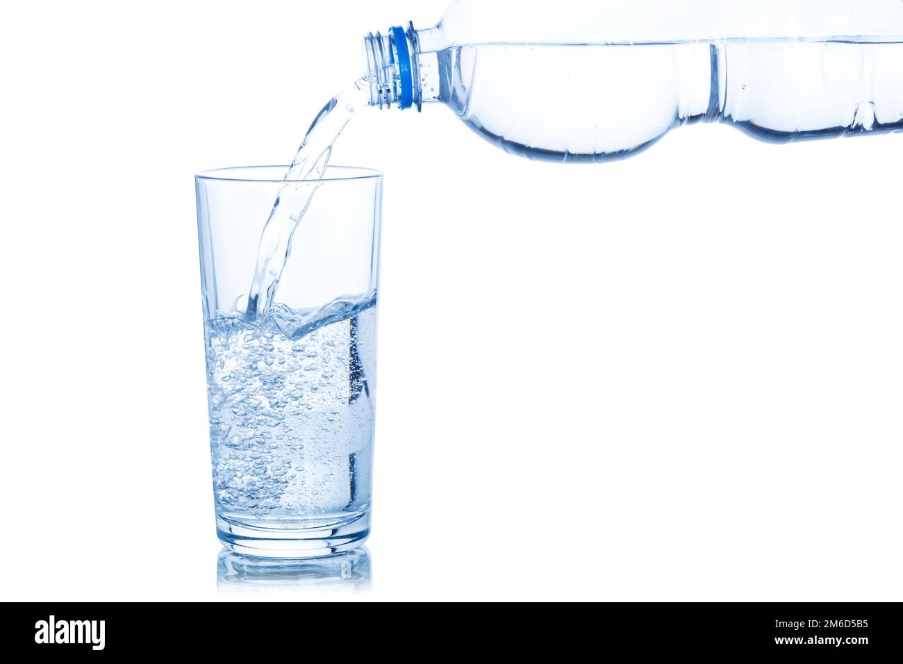 Water pouring into glass bottle isolated on white Stock Photo - Alamy