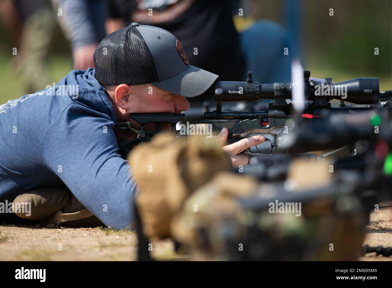 A competitor takes time during the match to practice their sight ...