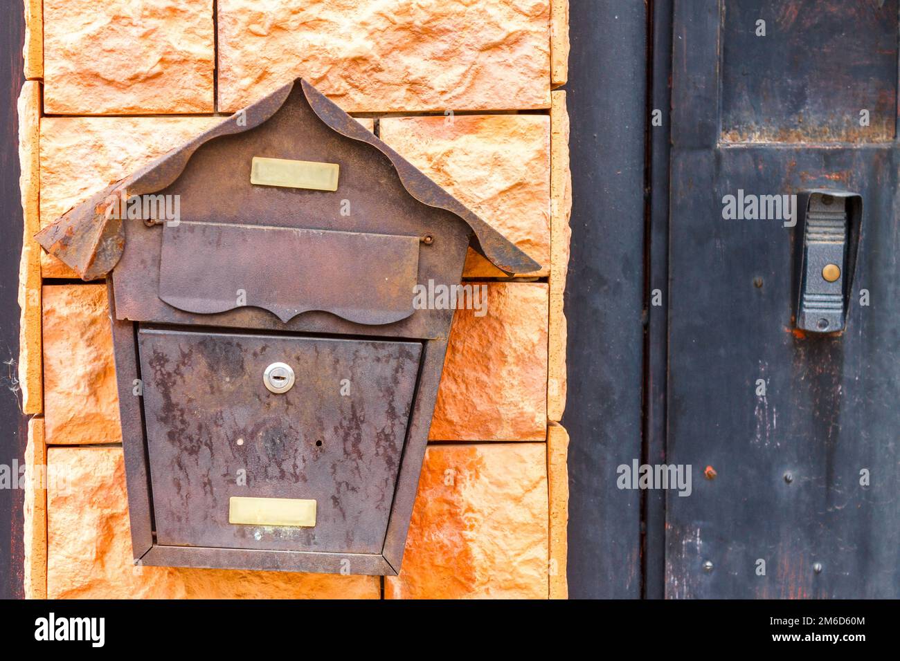 A beautiful mailbox hangs waiting for newspapers, parcels and letters ...