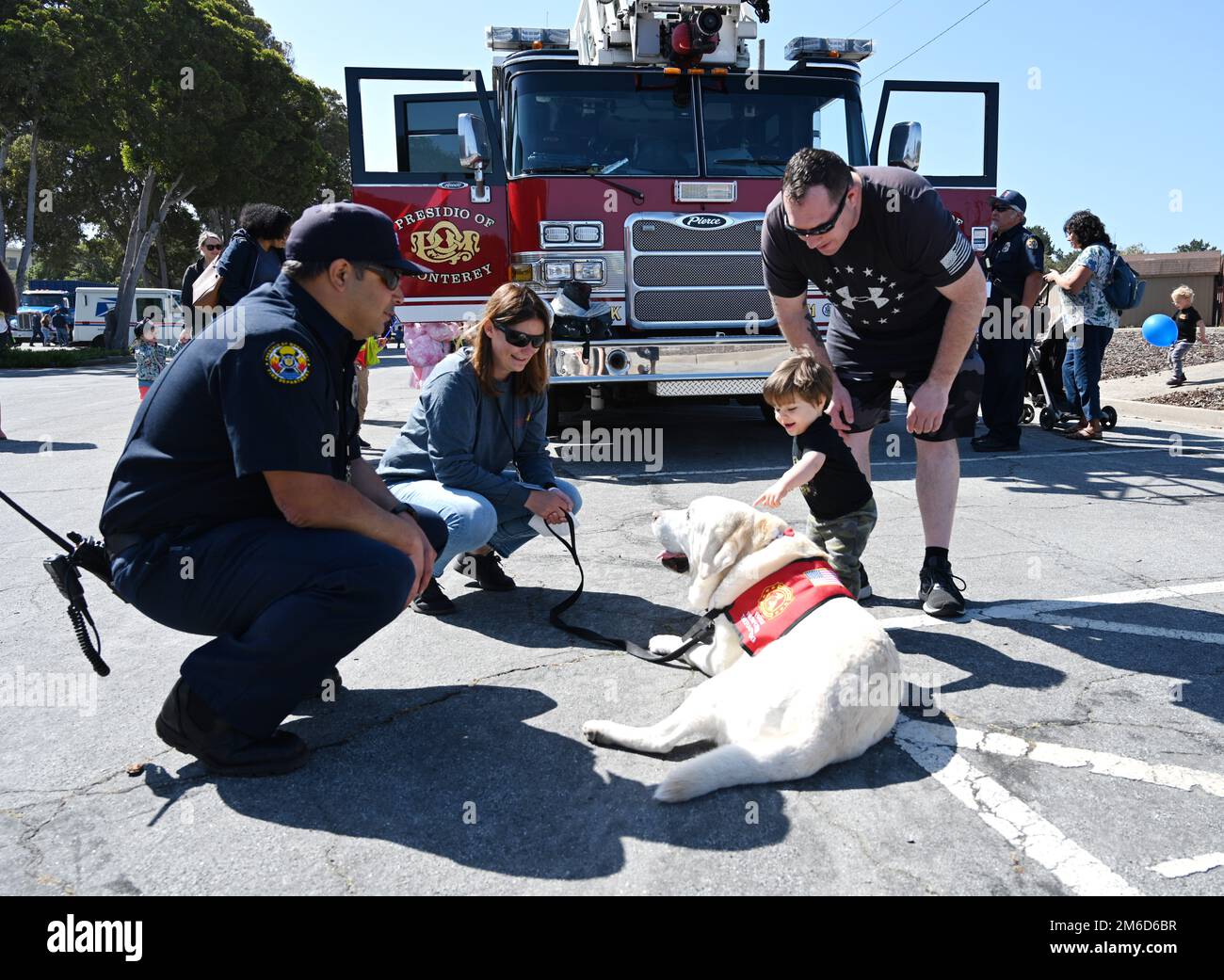 A child meets Cletus the first responder therapy dog during the Touch-A ...