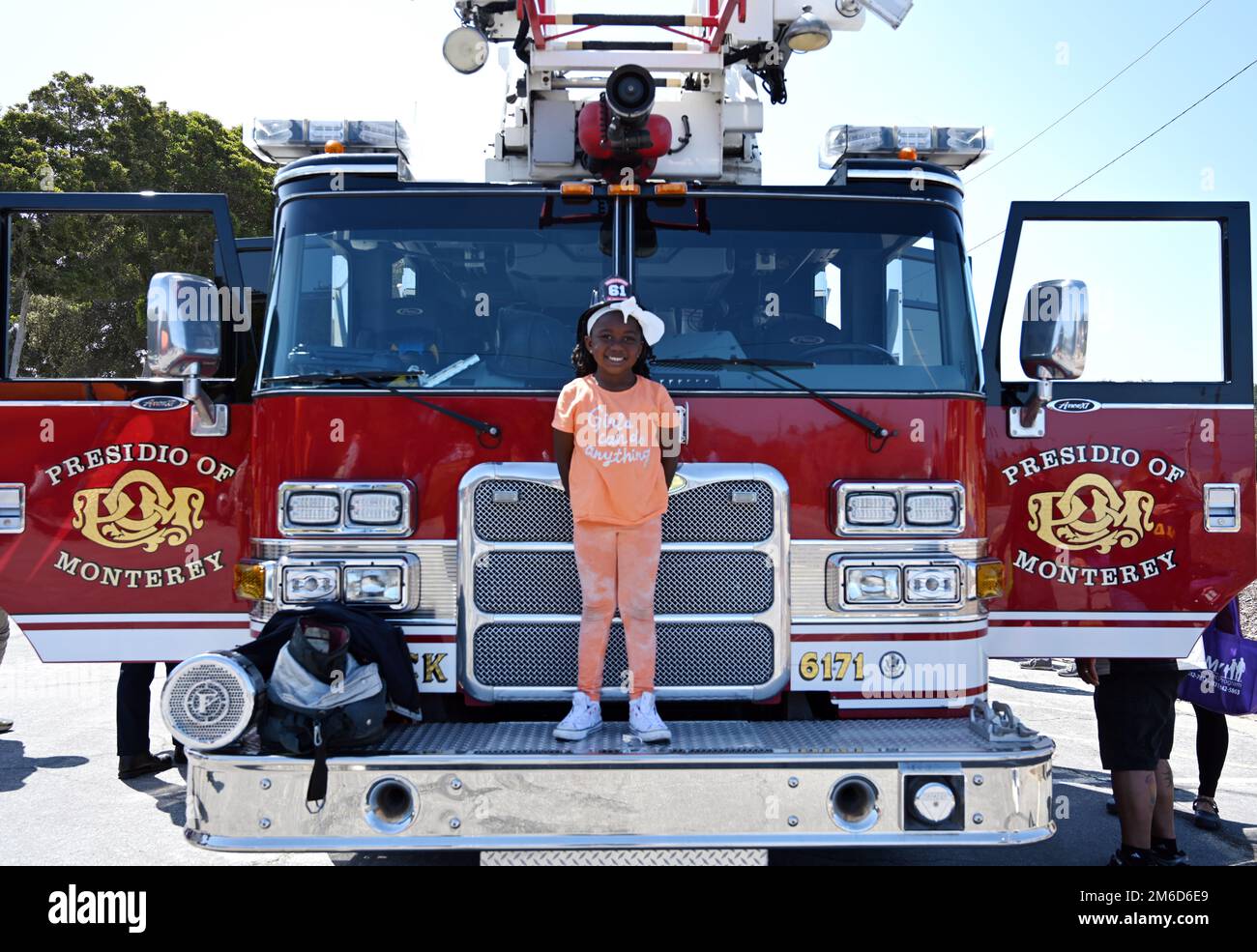 A child poses for a photo on a Presidio of Monterey fire truck during ...
