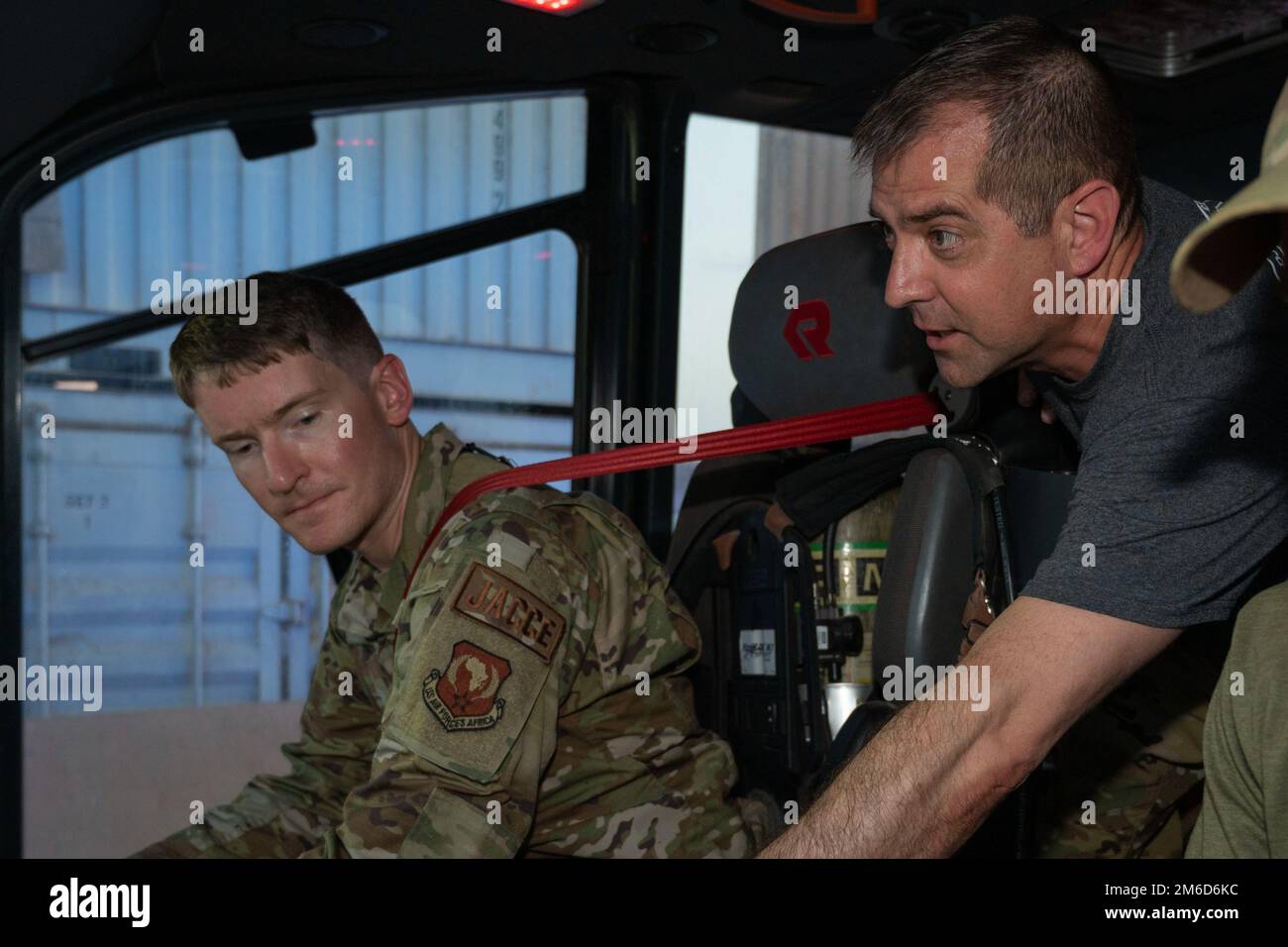 U.S. Air Force Maj. Walter Brim, left, with the Joint Air Component ...