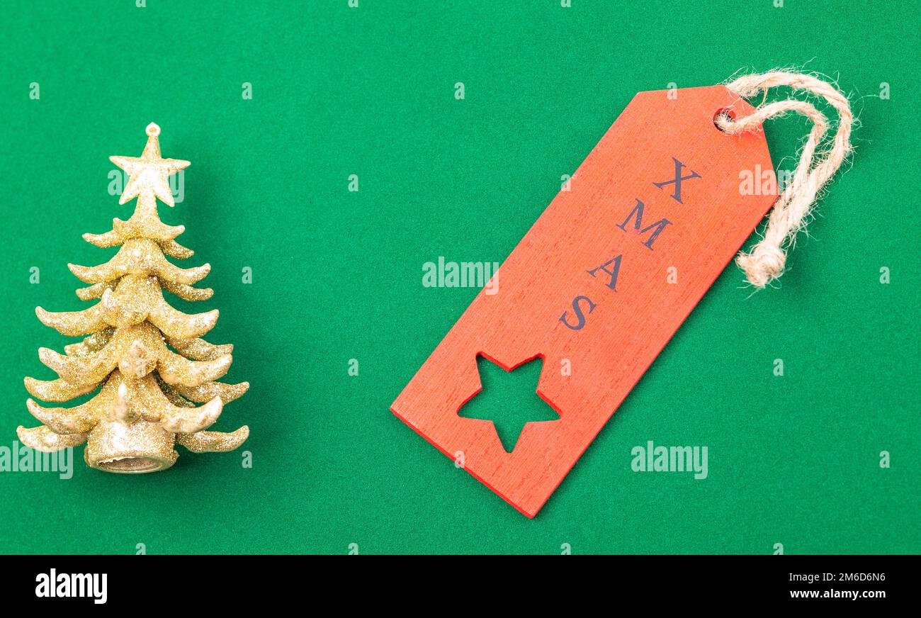 X-mas tree with red label Stock Photo - Alamy