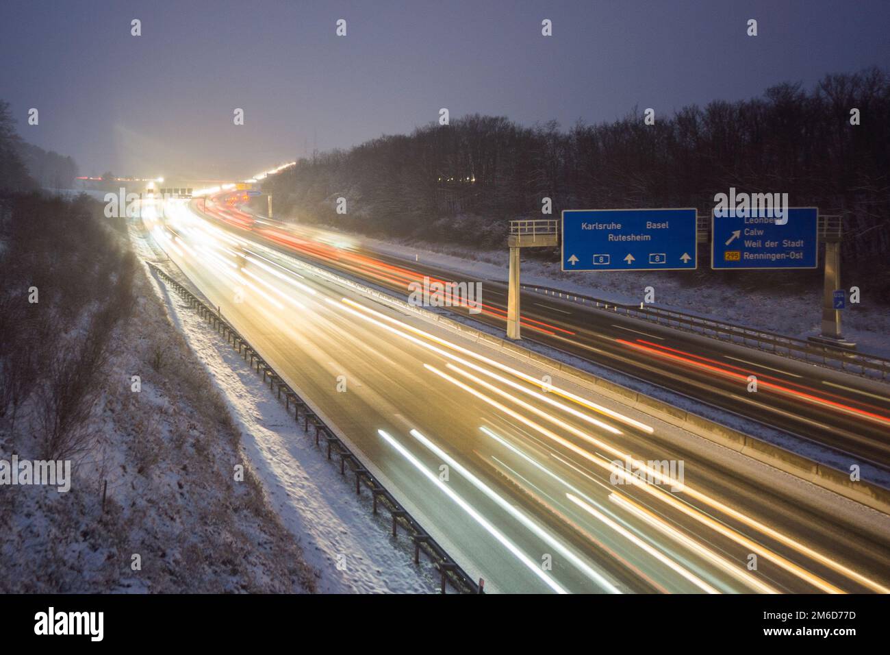 Freeway at night driving fast Stock Photo - Alamy