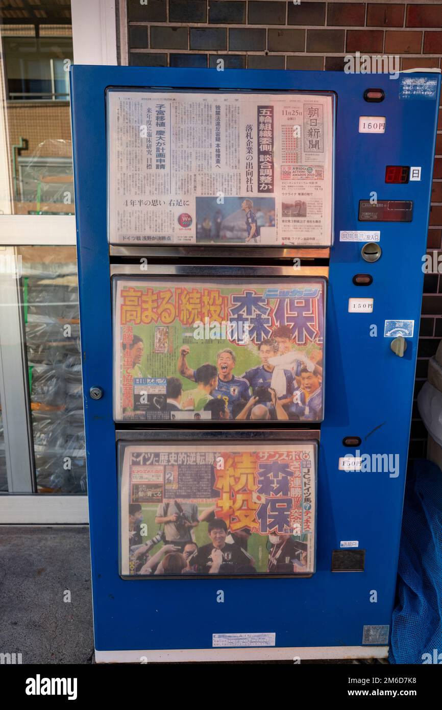 Tokyo, Japan. 25th Nov, 2022. A local newspaper newsstand and bicycle ...