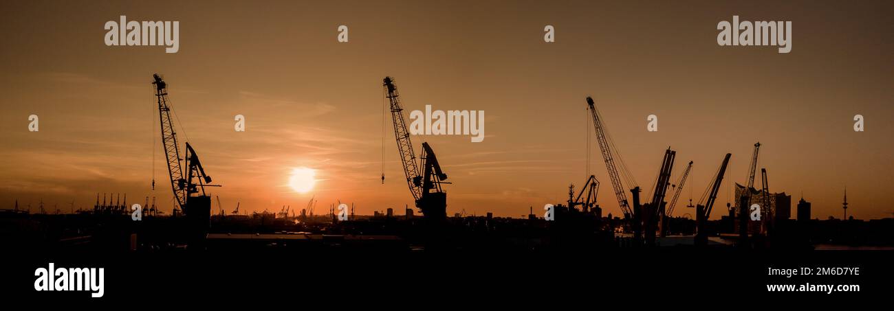 Silhouette of the Port of Hamburg at sunset Stock Photo - Alamy