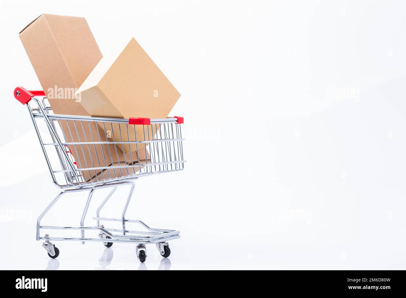 Shopping cart with packages Stock Photo - Alamy