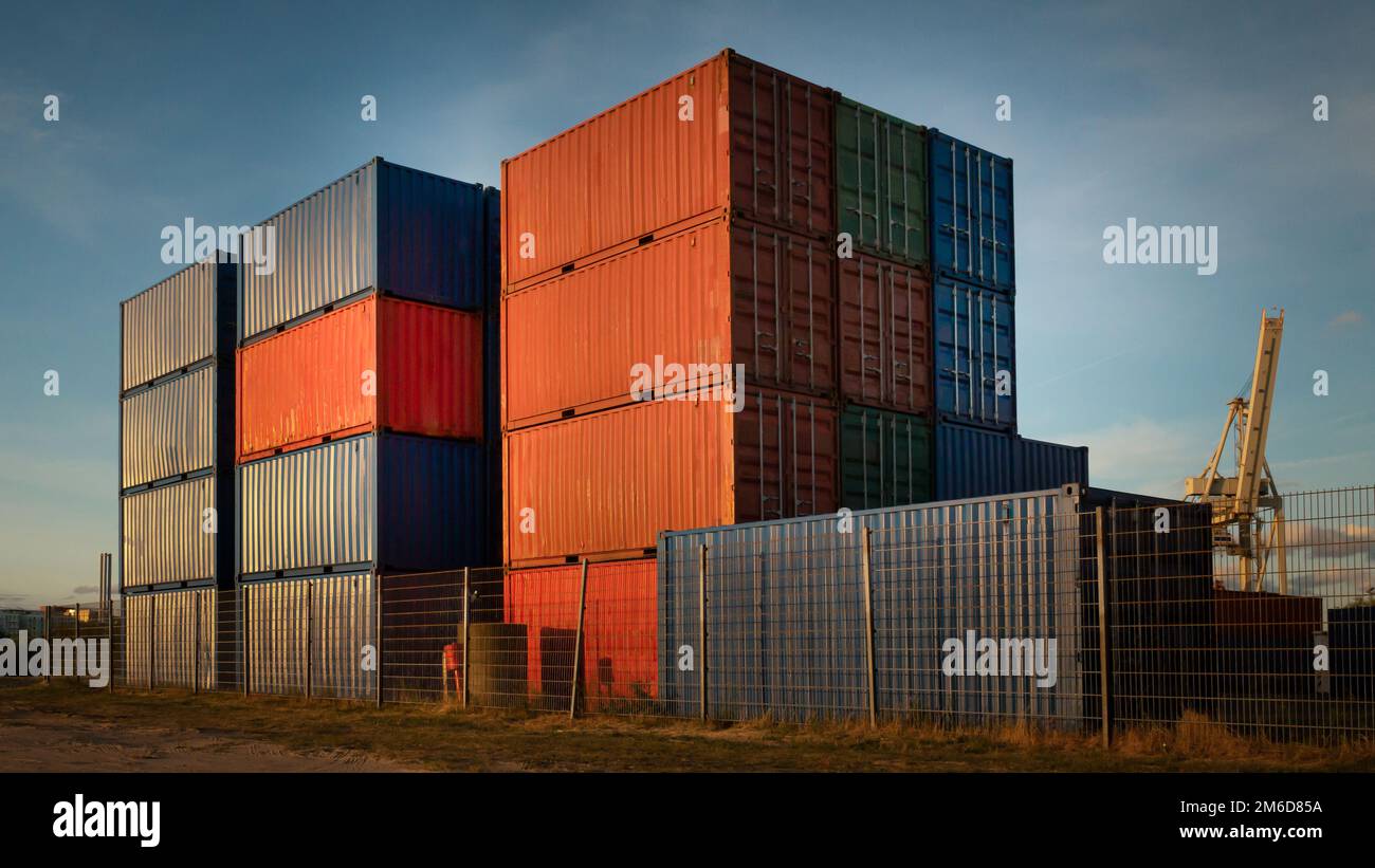 Container stack in Hamburg harbour at sunset Stock Photo - Alamy