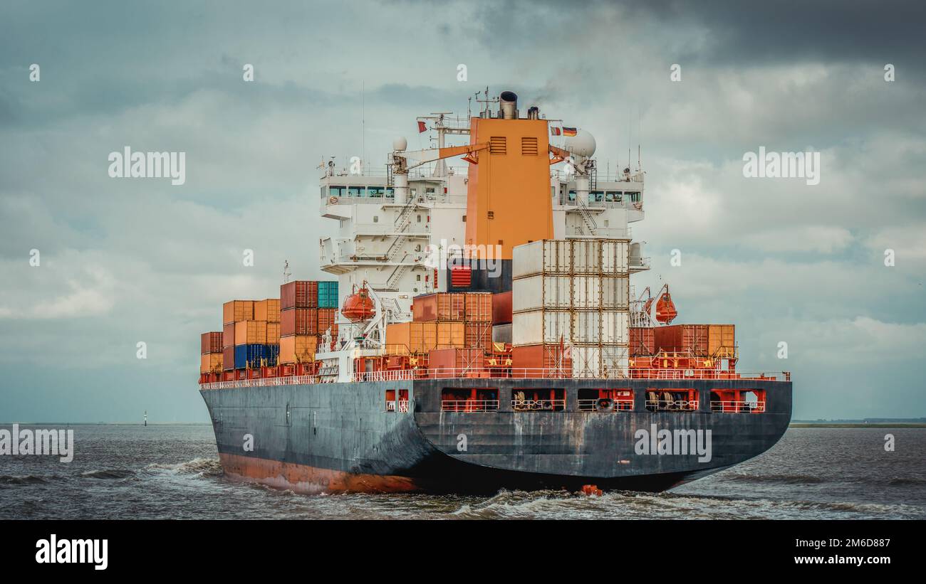Container ship from behind on the way to the North Sea Stock Photo - Alamy