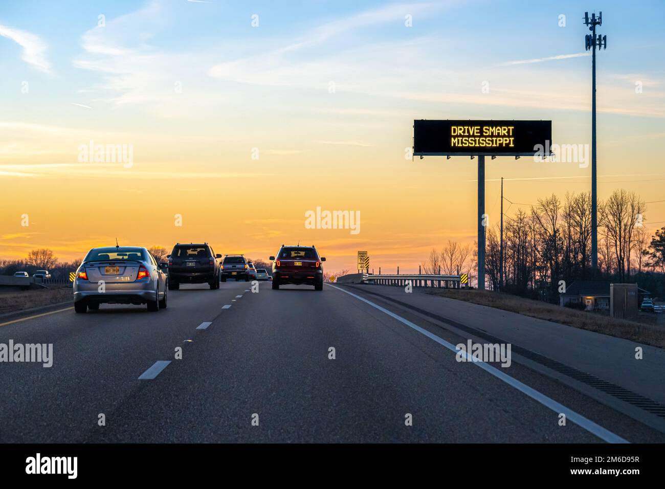 "Drive Smart Mississippi" message board sign along I-269 at sunset in ...